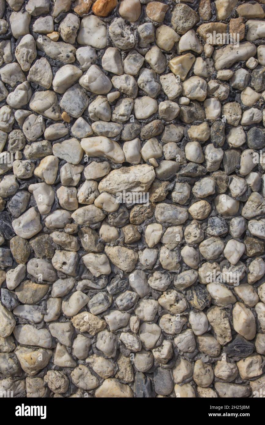 Wall made of small rock.Stone tile texture,Sandstone wall, a wall madei ...