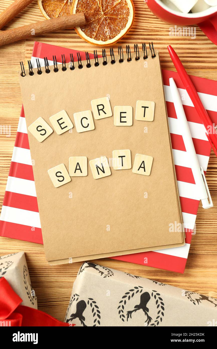 Secret Santa and Christmas composition on wooden background Stock Photo ...