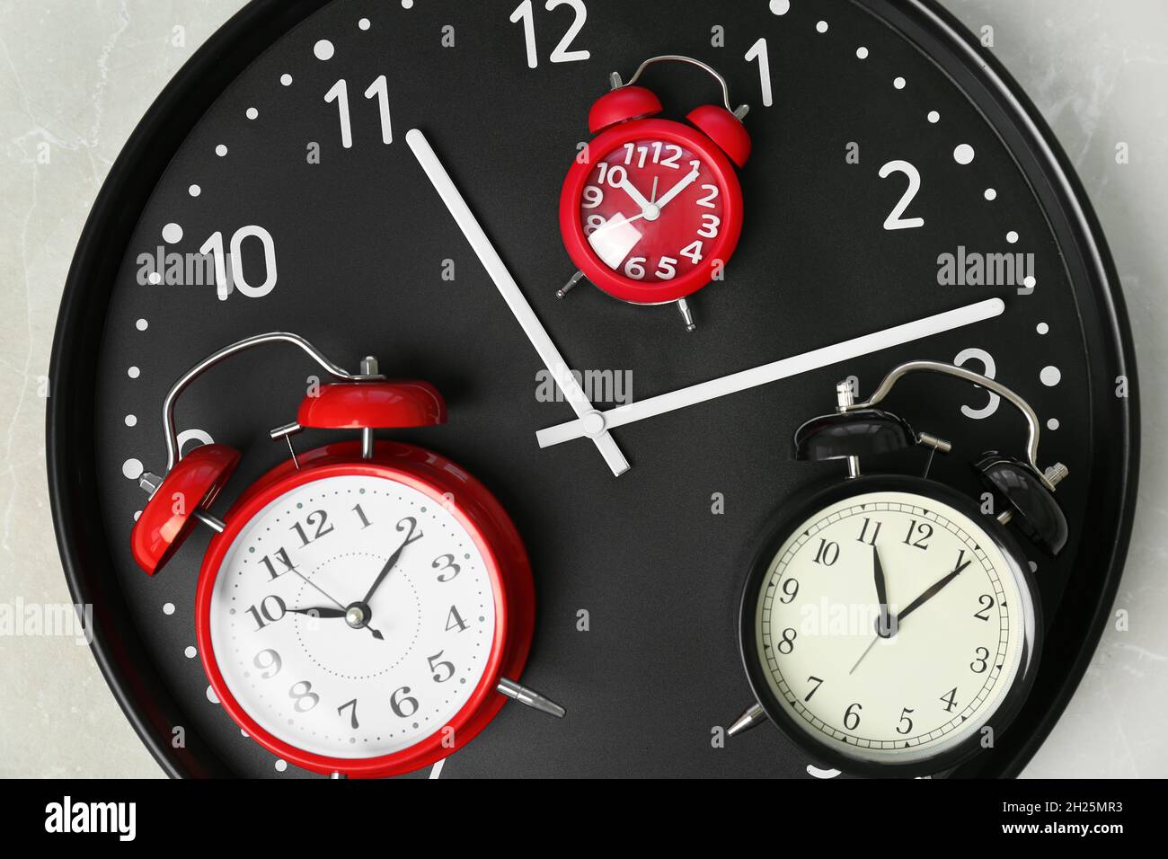 Many different clocks, top view. Time change concept Stock Photo - Alamy