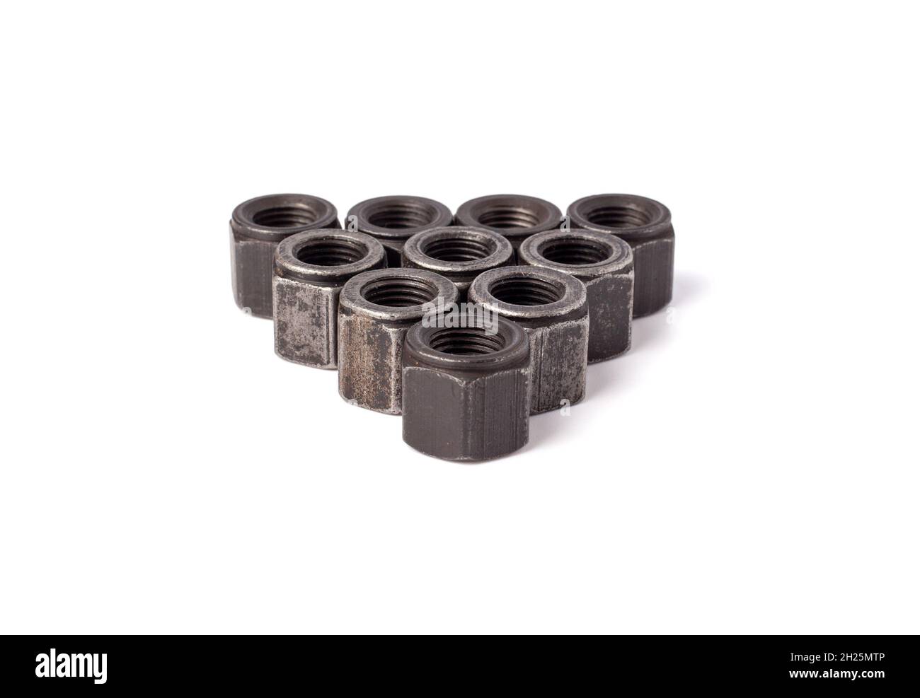 stack of metallic nuts isolated on white background. Heavy hex nut ...