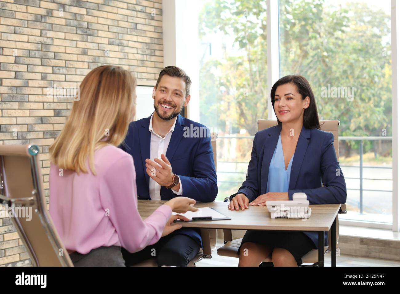 Human resources commission conducting job interview with applicant in office Stock Photo - Alamy