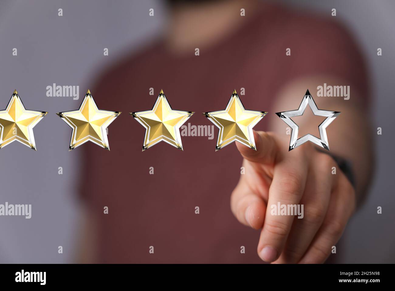 Person tapping on 3D rendered ranking stars Stock Photo - Alamy