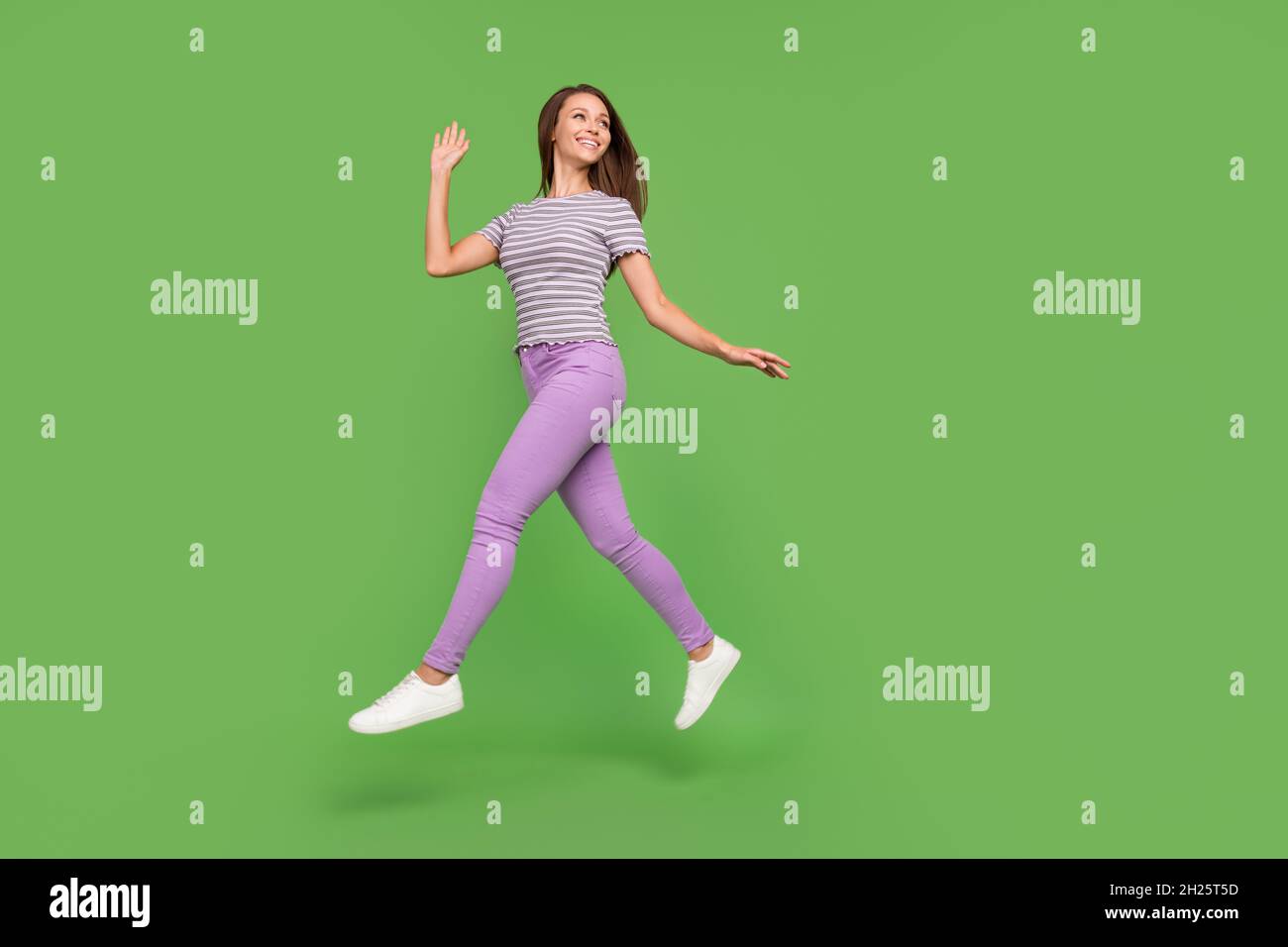 Full length body size view of attractive cheerful girl jumping going ...