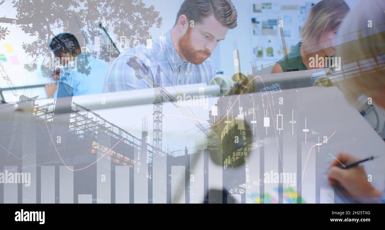 Graphs and architects drawing in an office and a building in ...