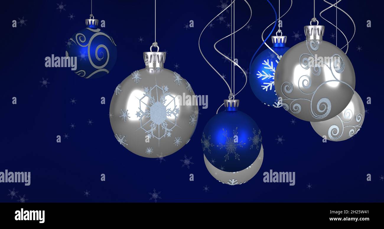 Image of baubles and snow falling on dark blue background Stock Photo ...
