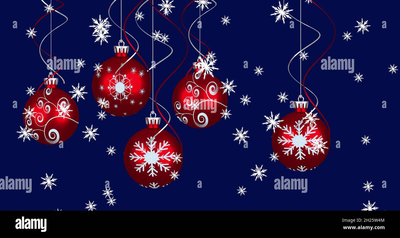 Image of baubles and snow falling on dark blue background Stock Photo ...