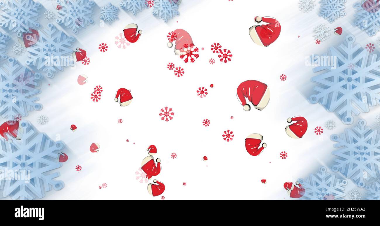 Image of santa hats falling over snow falling on white background Stock ...