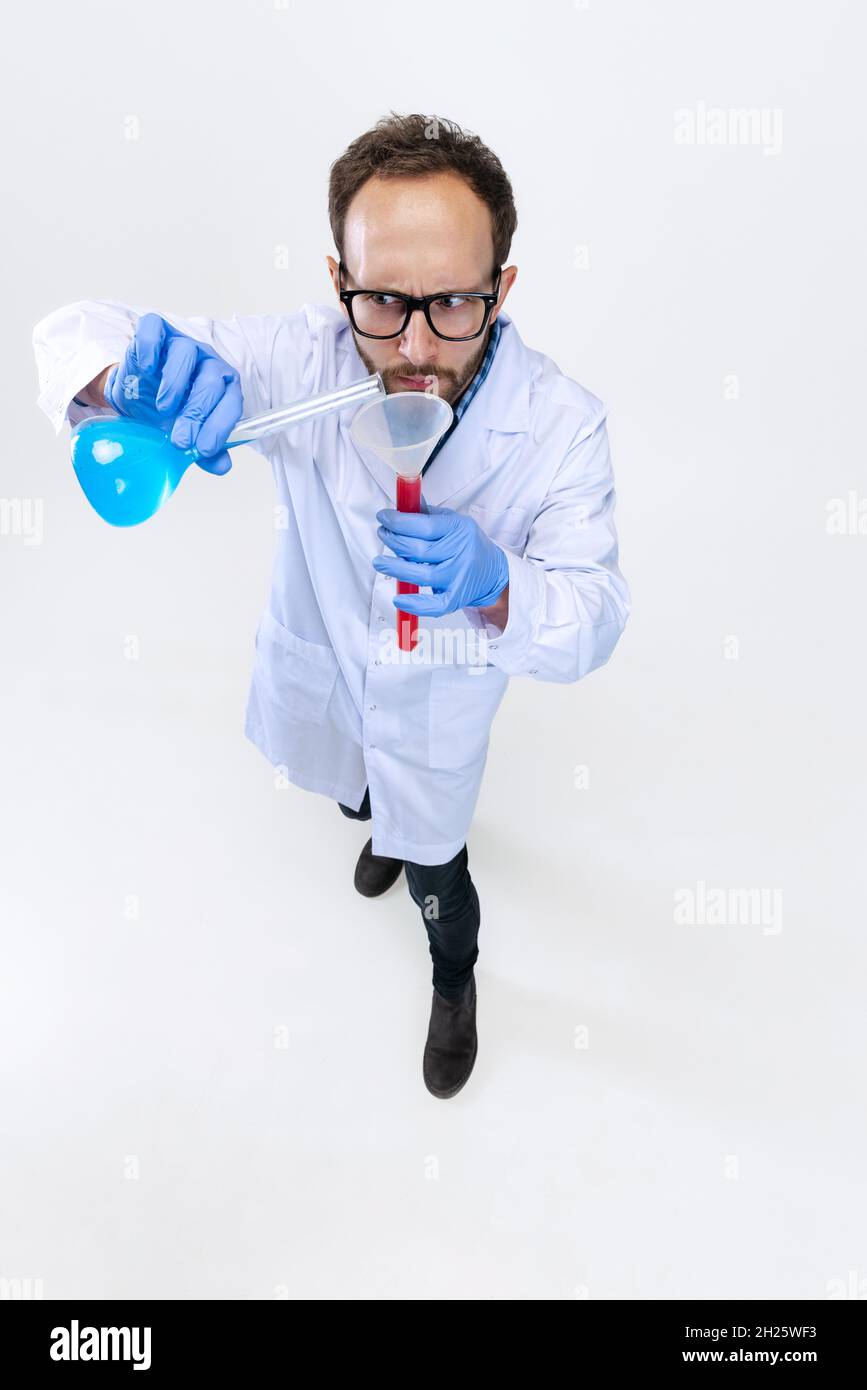 High angle view of young chemist, doctor conducts chemical research ...