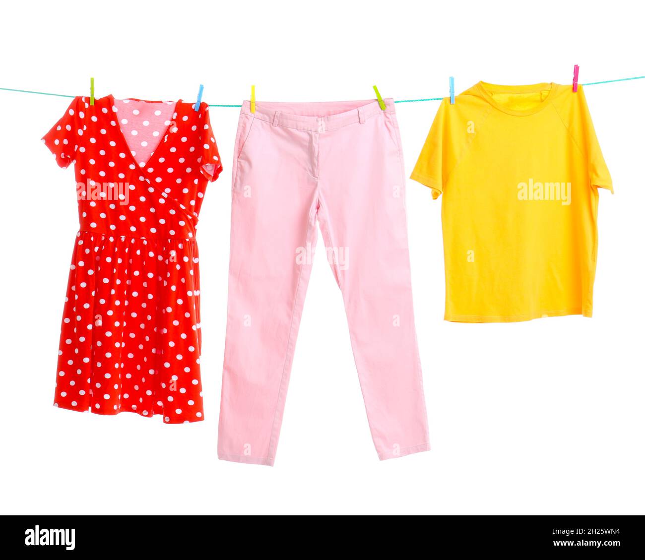 Clothes on laundry line against white background Stock Photo - Alamy