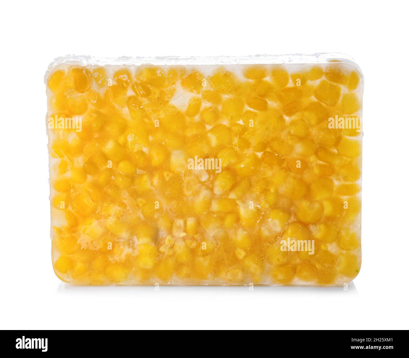 Corn grains in ice cube on white background. Frozen vegetables Stock ...