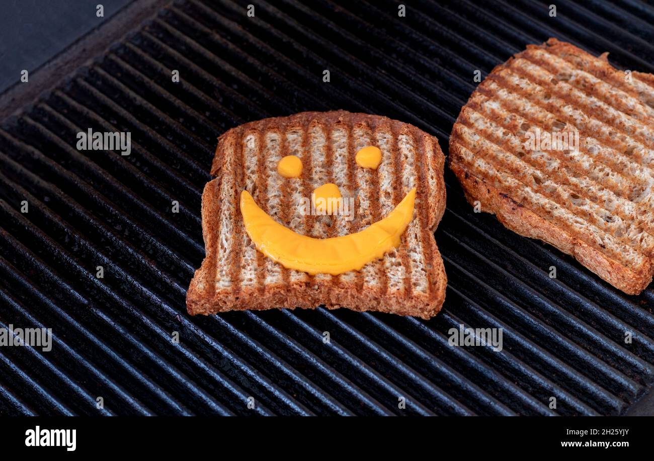 Toasted sandwiches with melting cheese on toaster or grill Stock Photo ...