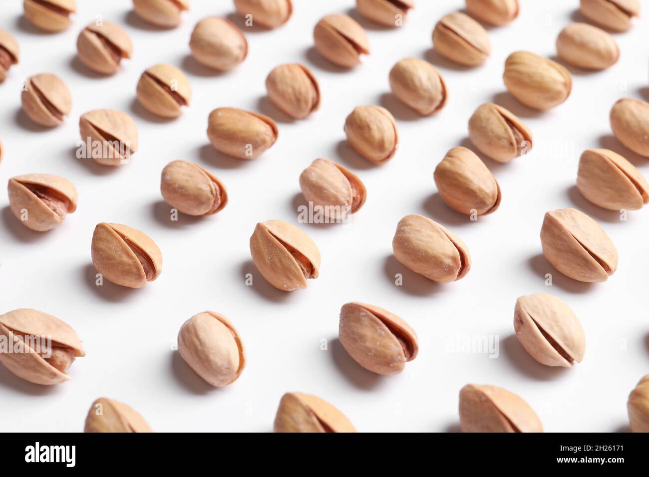Organic pistachio nuts in shell on white background Stock Photo - Alamy