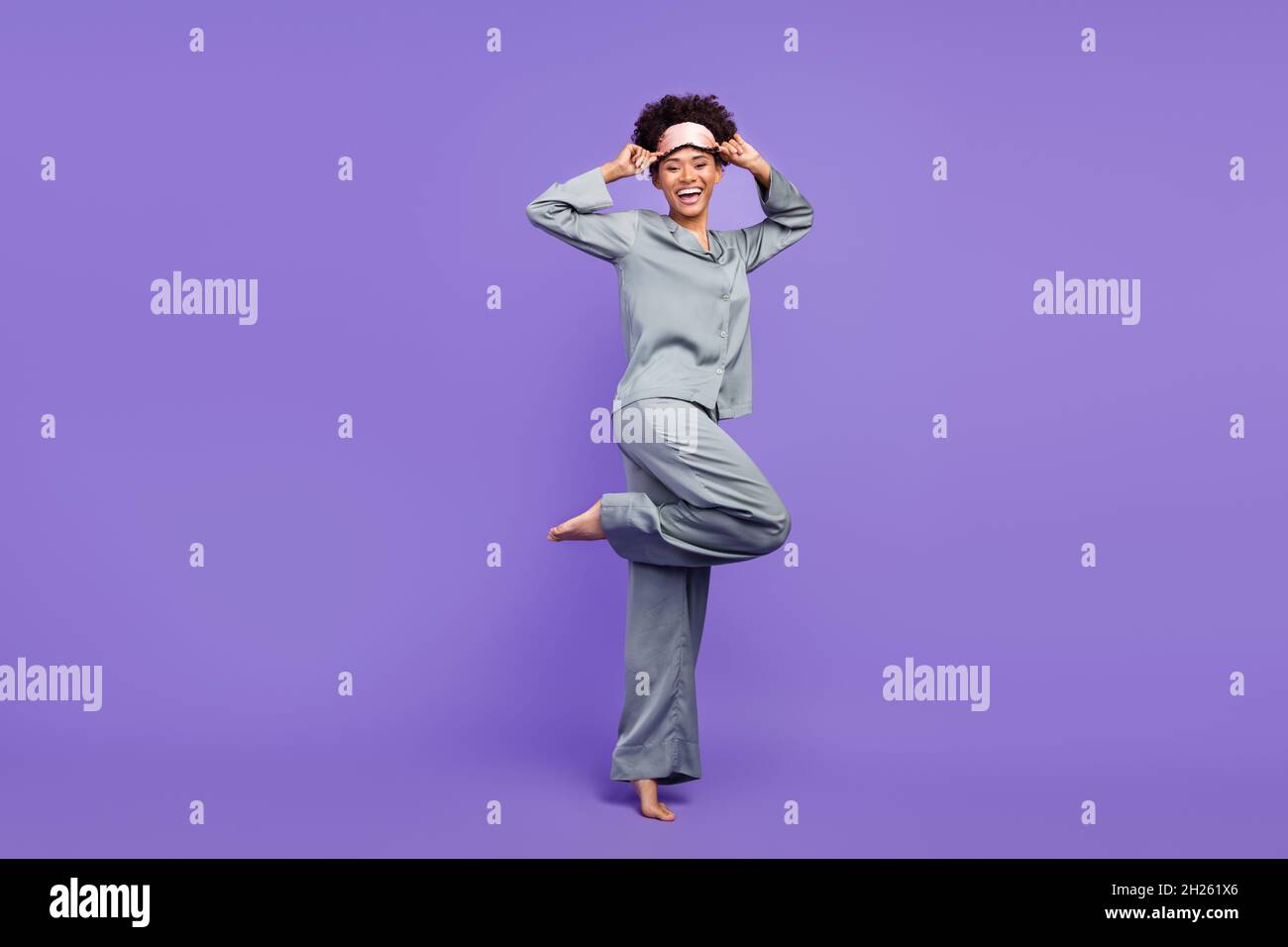 Photo of funny beautiful woman grey sleepwear smiling dancing arms ...