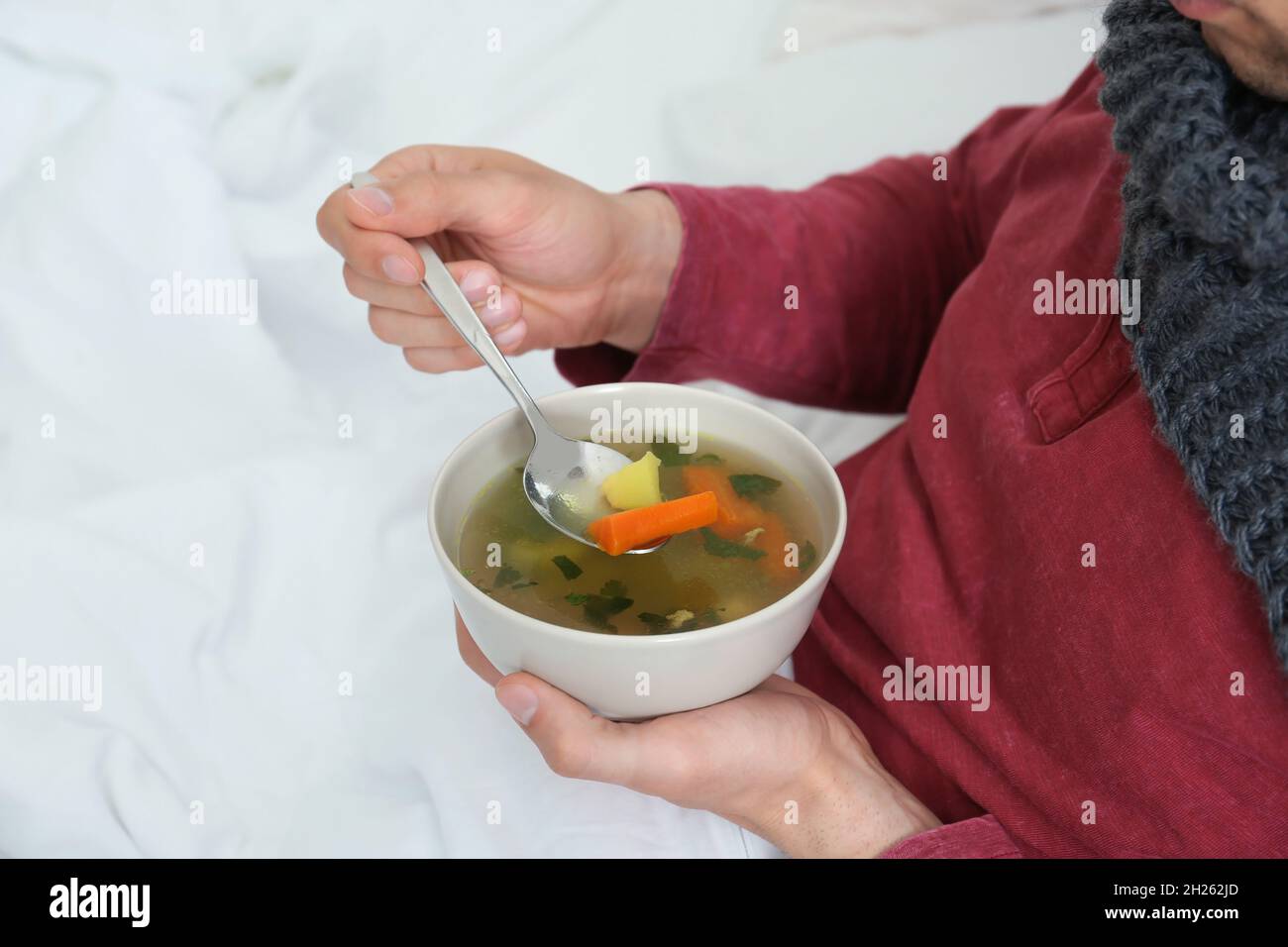 Sick man with chicken soup hi-res stock photography and images - Alamy