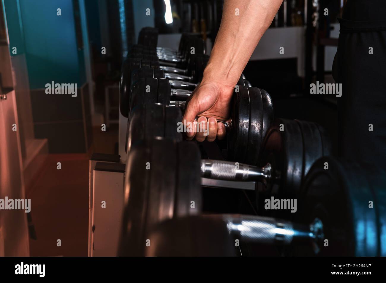 Athlete takes dumbbell training hi-res stock photography and images - Alamy