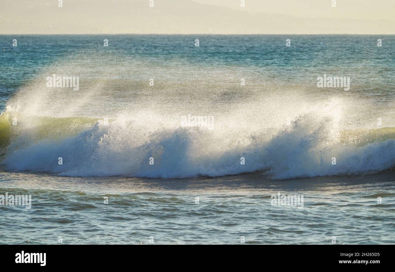 Breaking waves on coast in Spain, Andalusia, Spain Stock Photo - Alamy