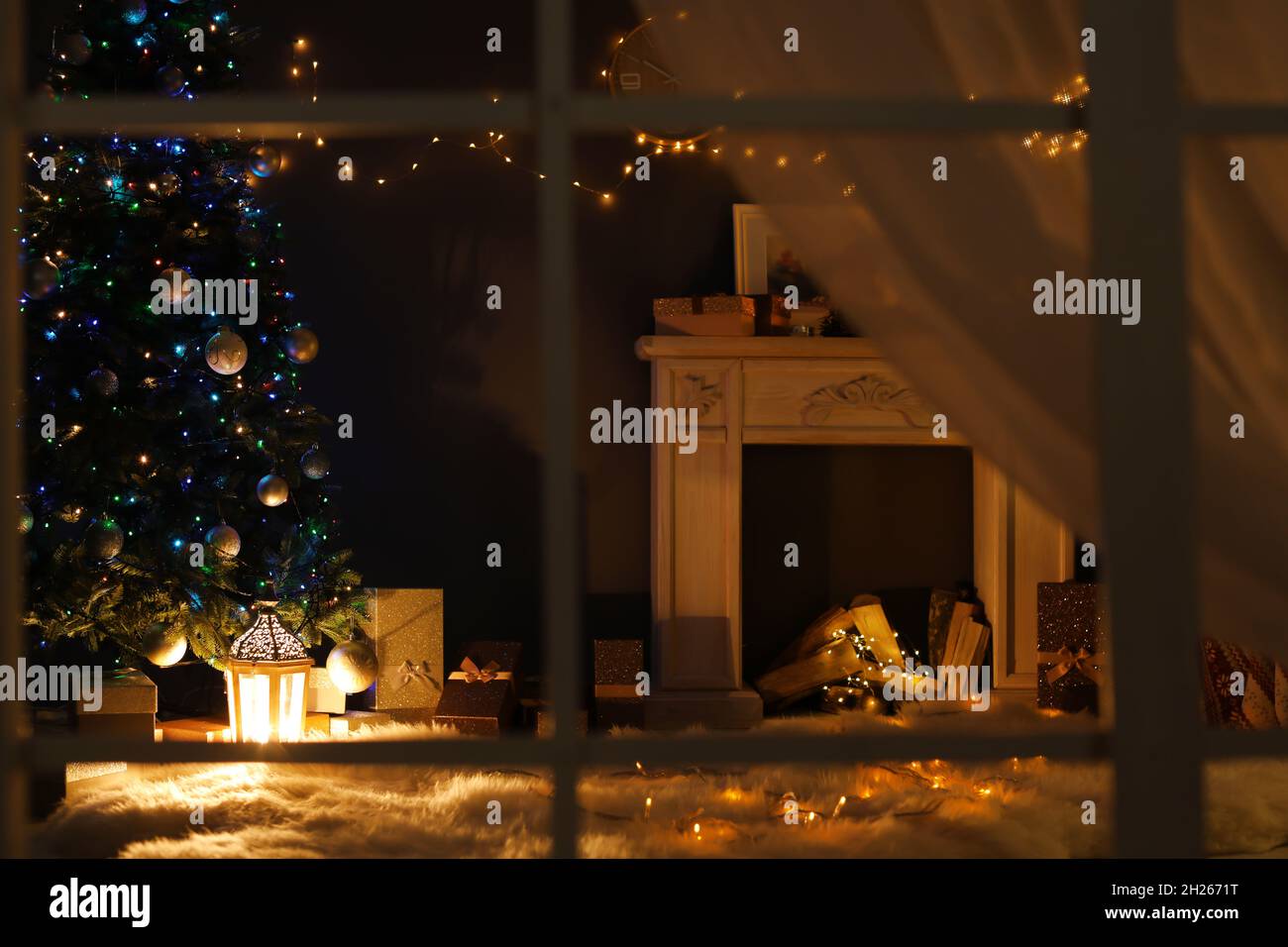 Stylish living room interior with decorated Christmas tree and ...