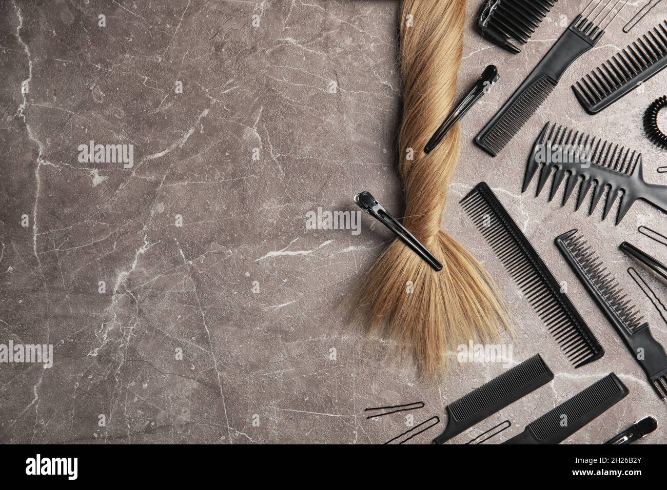 Flat lay composition with hair salon tools on grey background. Space ...
