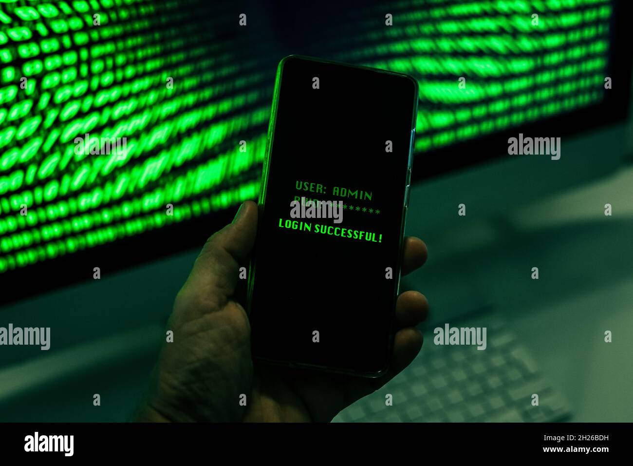 Hand with smartphone doing successful login in a digital network ...