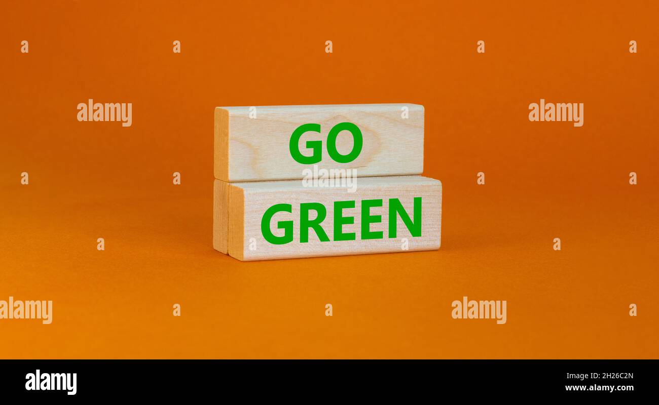 Time to go green ecology symbol. Concept words Go green on wooden ...
