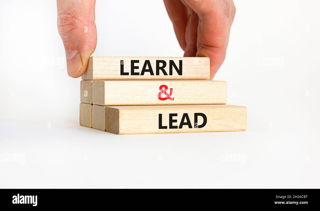 Learn and lead symbol. Concept words 'Learn and lead'. Businessman hand ...