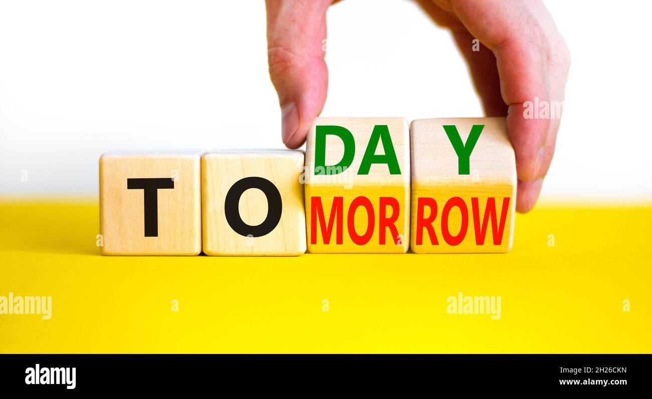 Do it today not tomorrow. Businessman turns wooden cubes and changes ...
