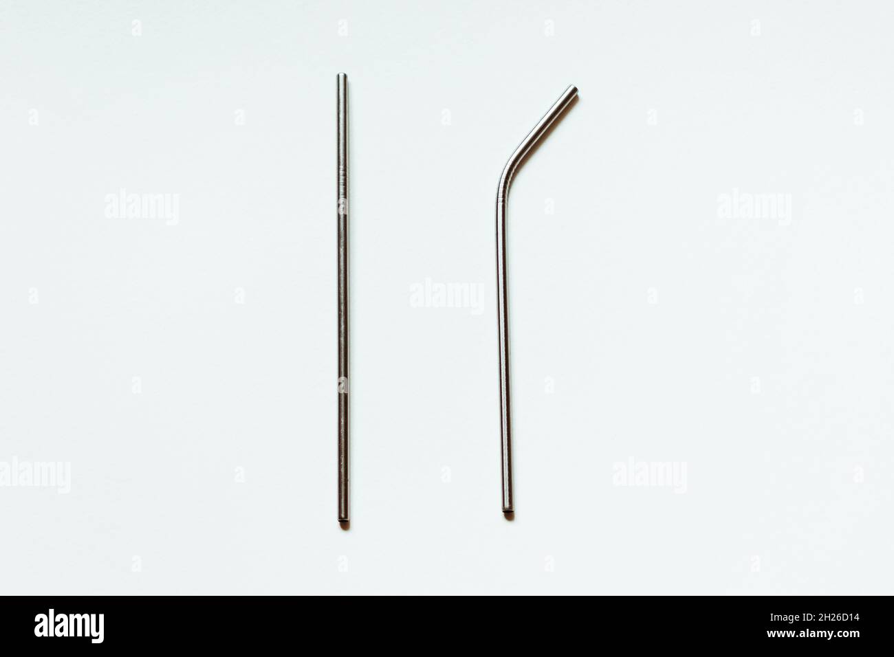 Two metal reusable straws for drinks on a white background Stock Photo ...
