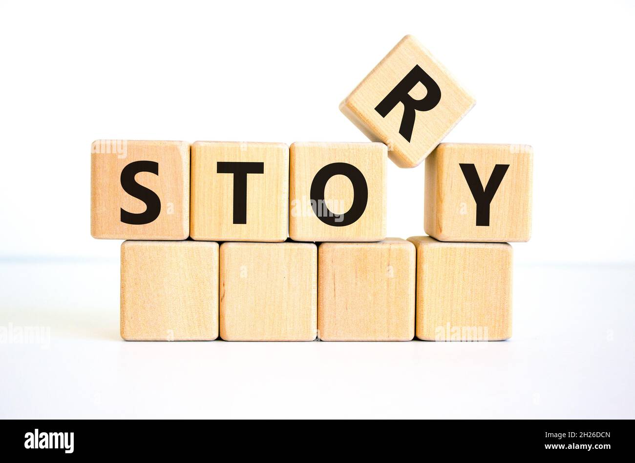 Story and storytelling symbol. The concept word 'story' on wooden cubes ...
