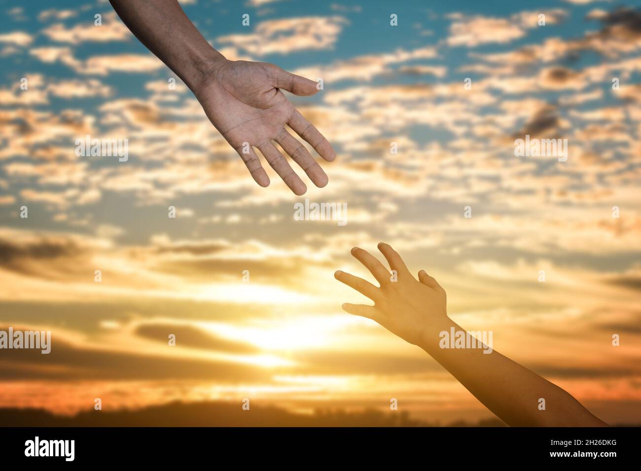 Giving a help hand concept. Reaching hand helping, hope and support ...