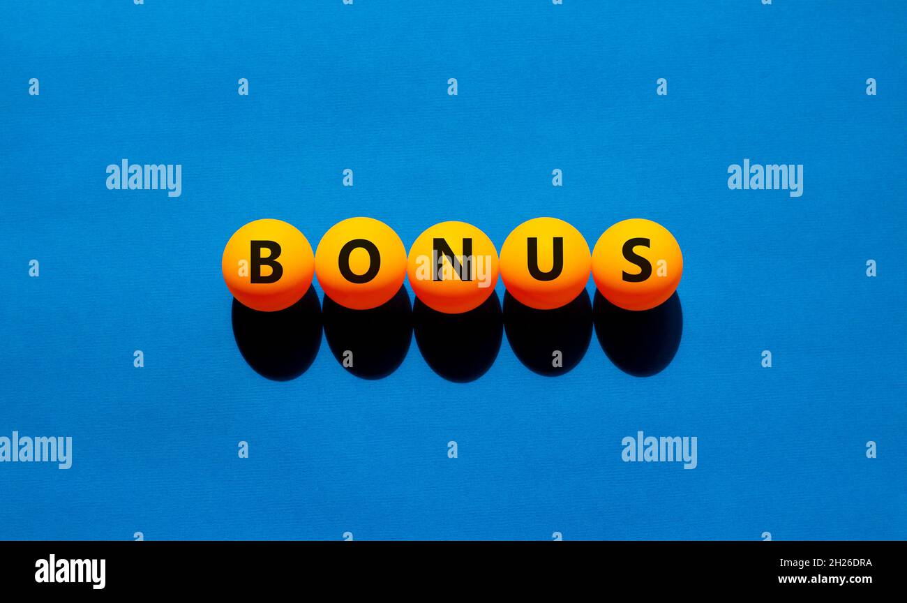 Bonus symbol. The concept word 'bonus' on orange table tennis balls ...