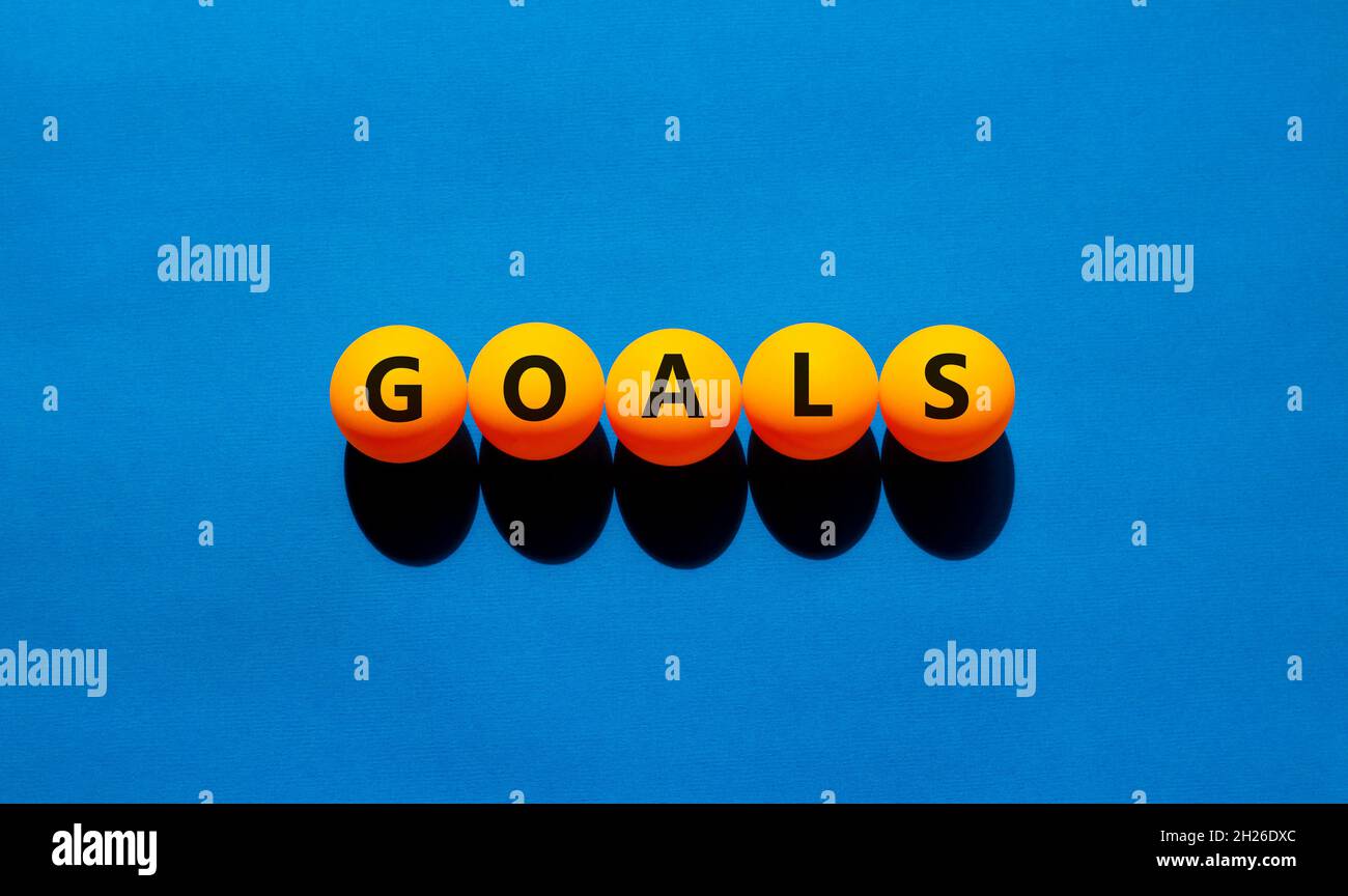 Goals symbol. The concept word 'goals' on orange table tennis balls ...