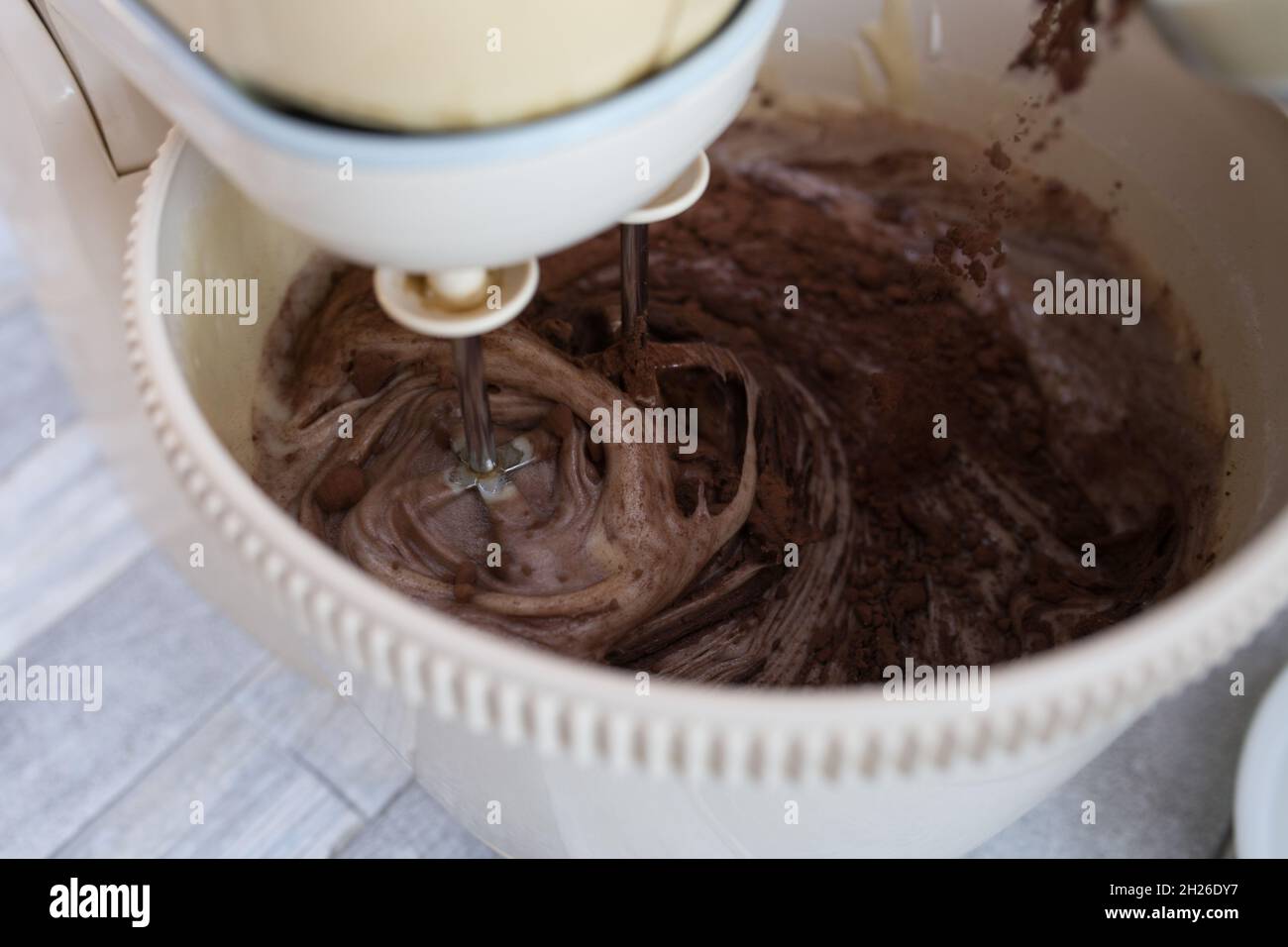 Step-by-step process of making a sour cream chocolate cake. Beat the ...