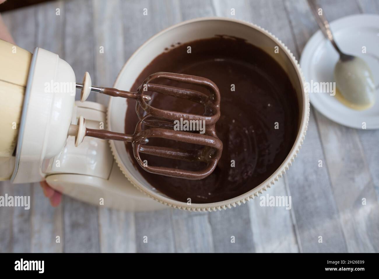 Step-by-step process of making a sour cream chocolate cake. Beat the ...