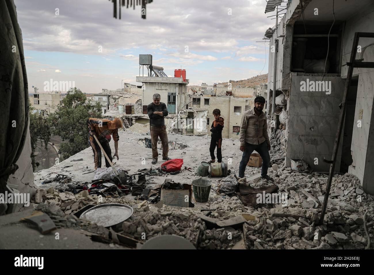 Ariha, Syria. 20th Oct, 2021. Khaled Ibrahim, 58, and his children ...