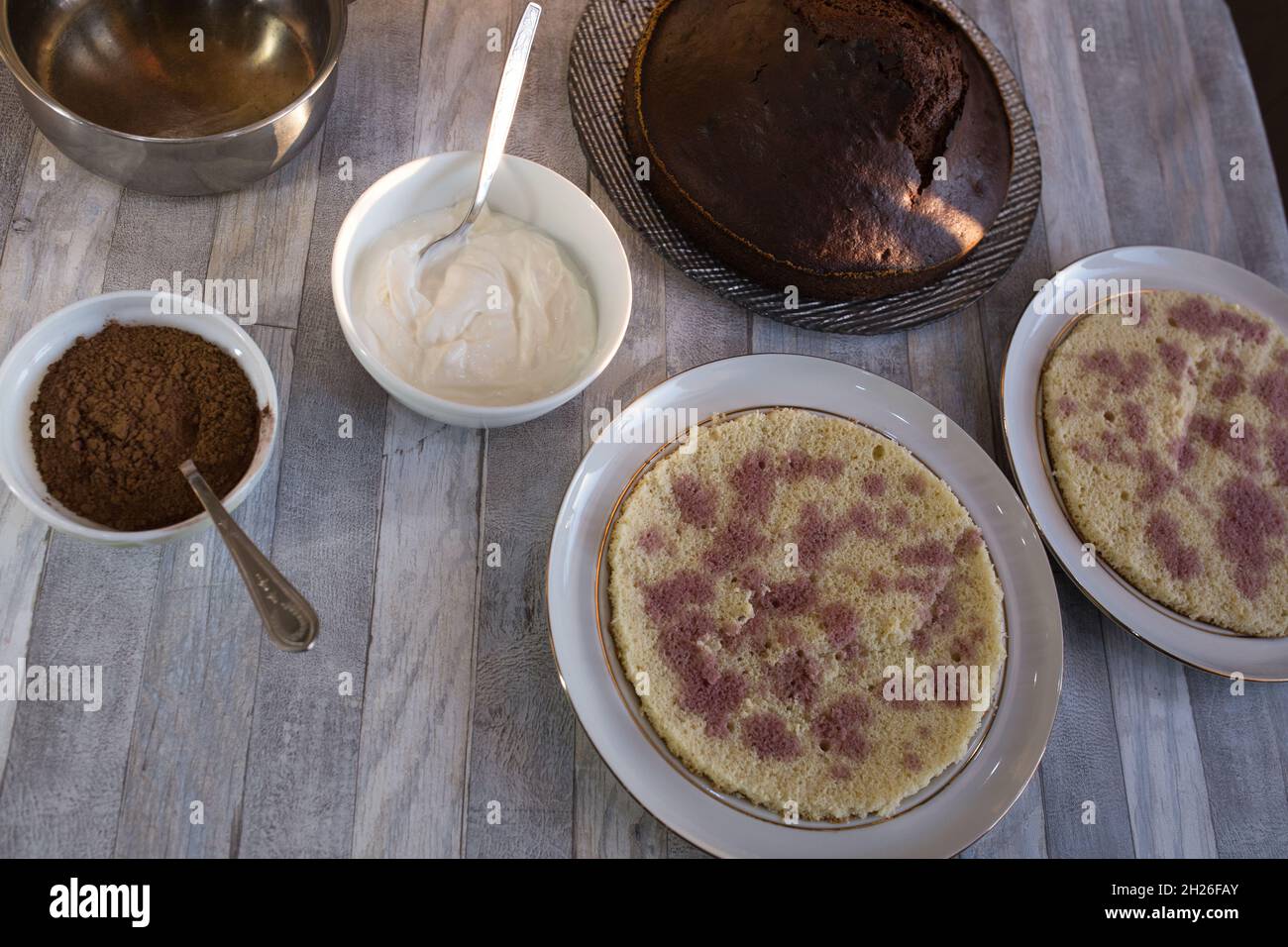 Step-by-step process of making a sour cream chocolate cake. Forming the ...