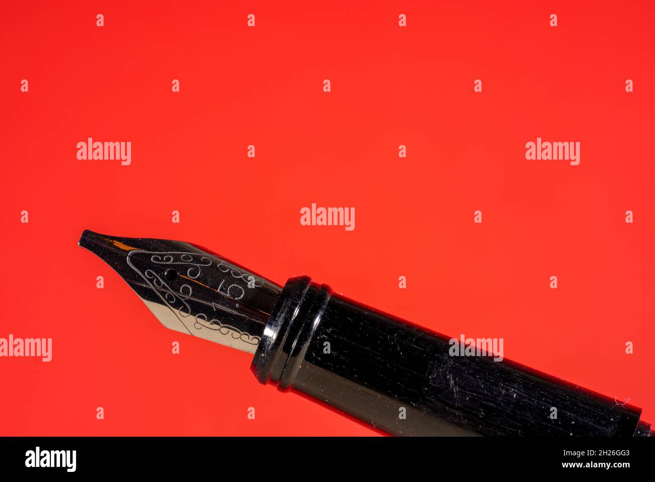 Fountain Pen with plain paper as a background with copy space ...