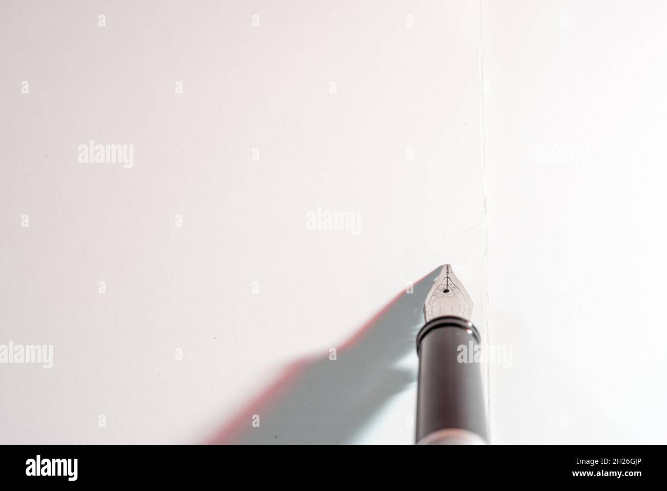 Fountain Pen with plain paper as a background with copy space ...
