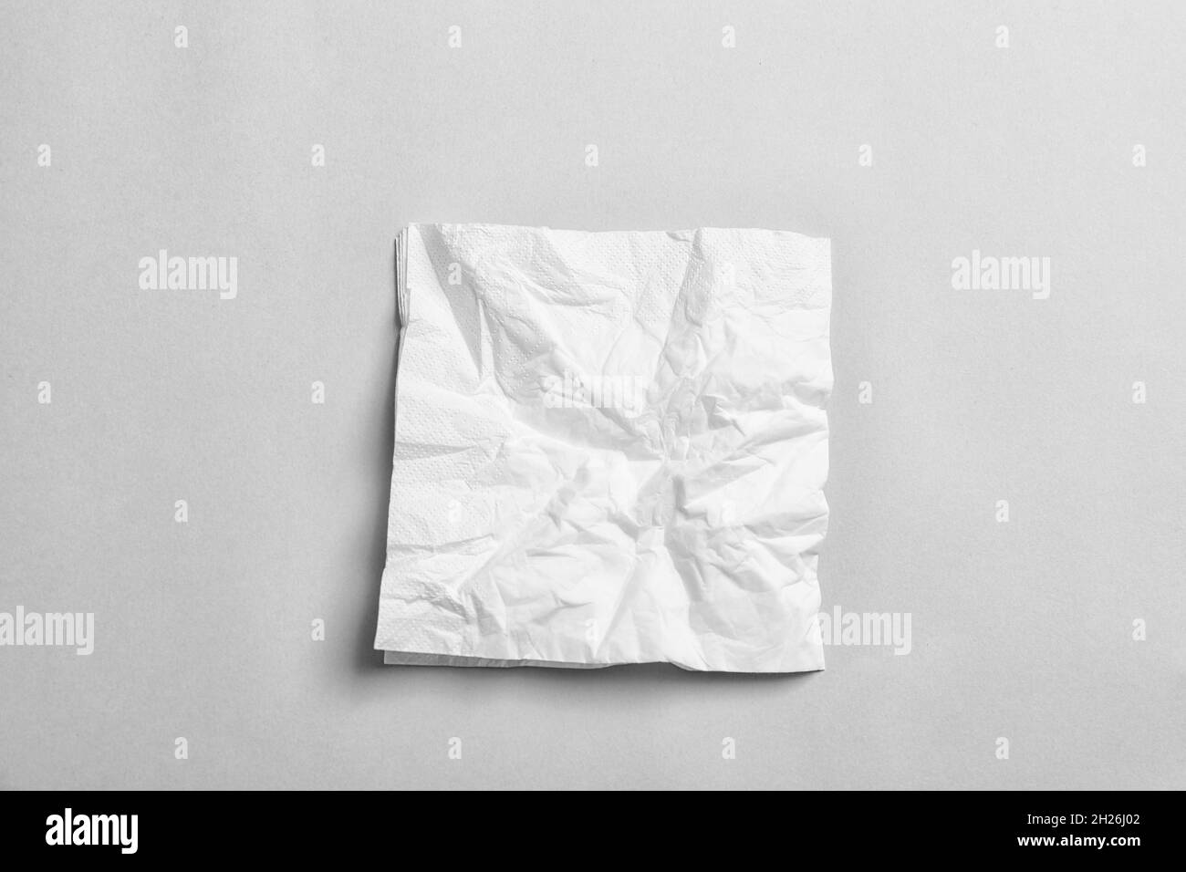 Crumpled napkin on grey background, top view. Personal hygiene Stock ...