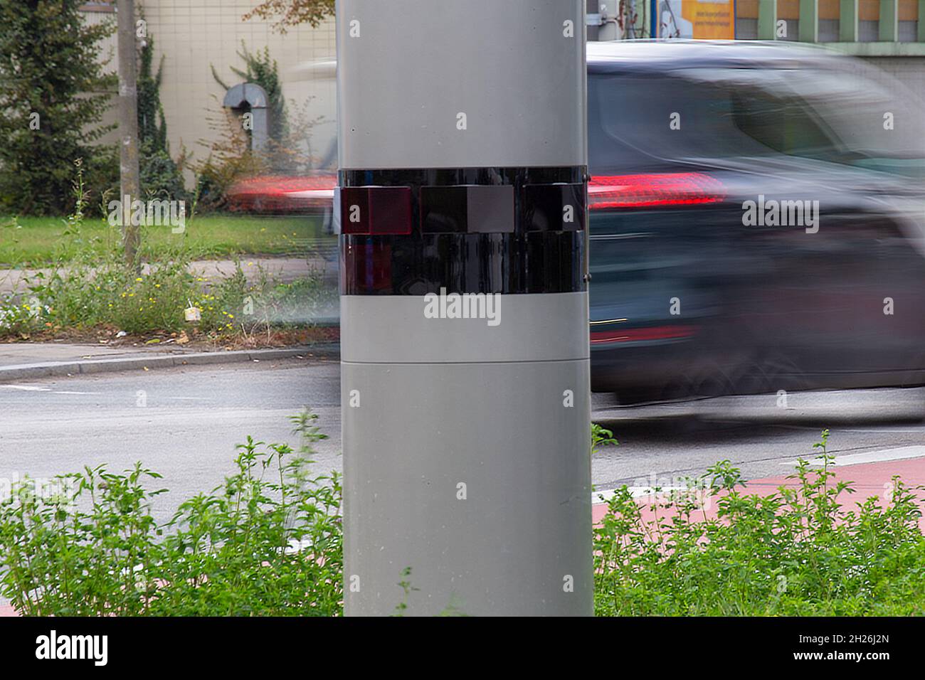Symbol image: Close-up of a speed trap with passing cars, long time ...