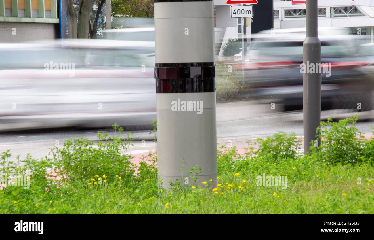 Symbol image: Close-up of a speed trap with passing cars, long time ...
