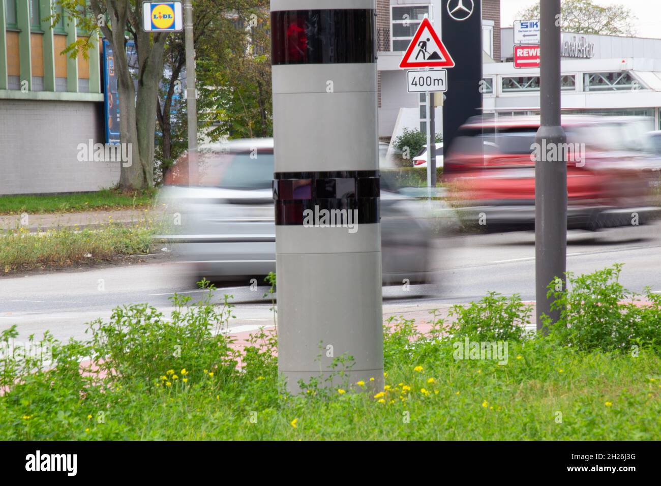 Symbol image: Close-up of a speed trap with passing cars, long time ...