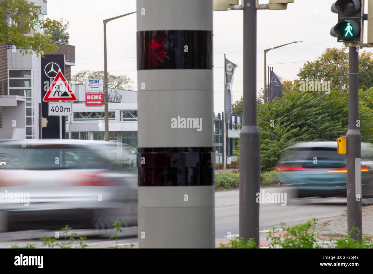 Symbol image: Close-up of a speed trap with passing cars, long time ...