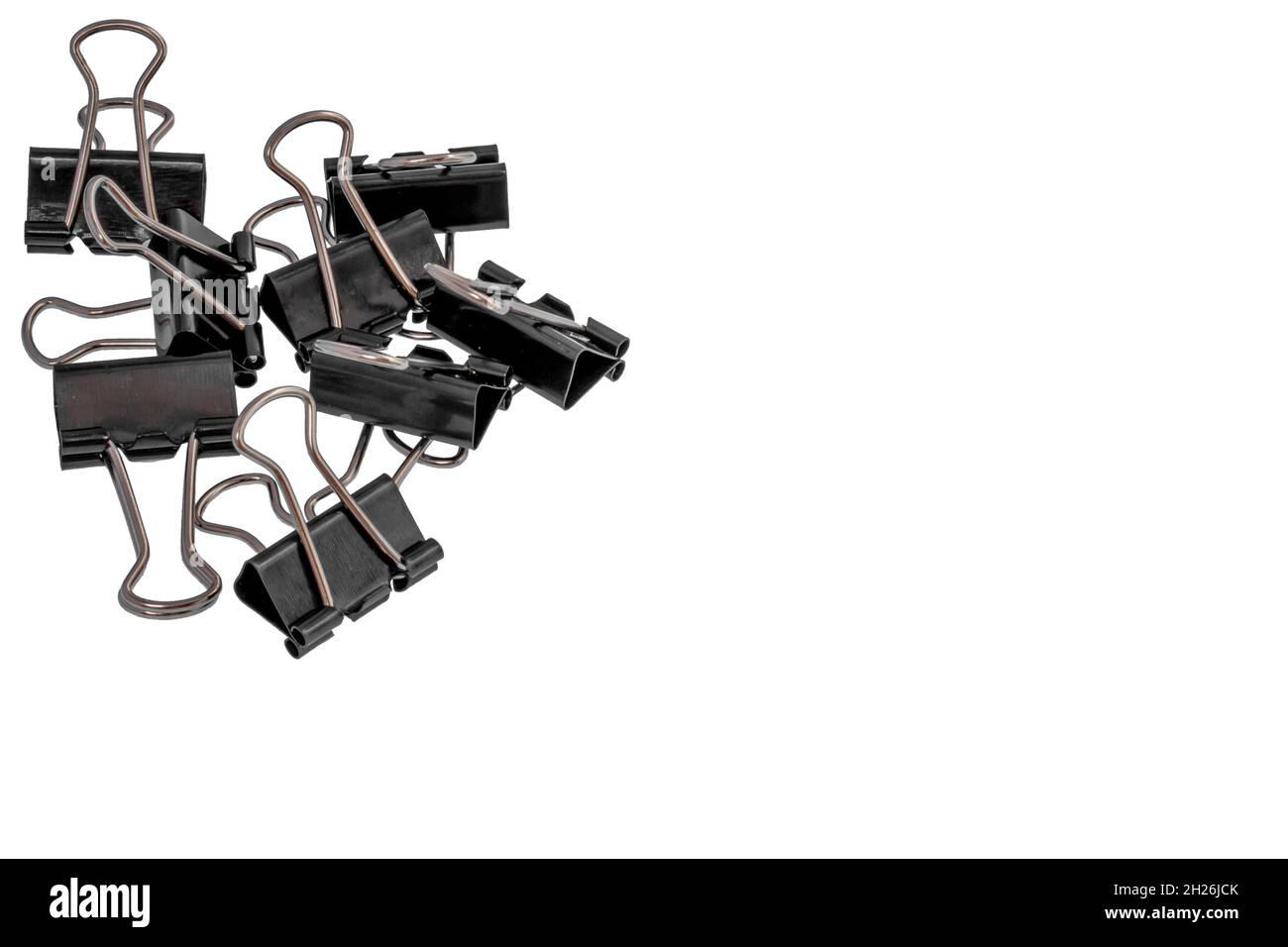 A group of metal paper clips in black, isolated on a white background ...