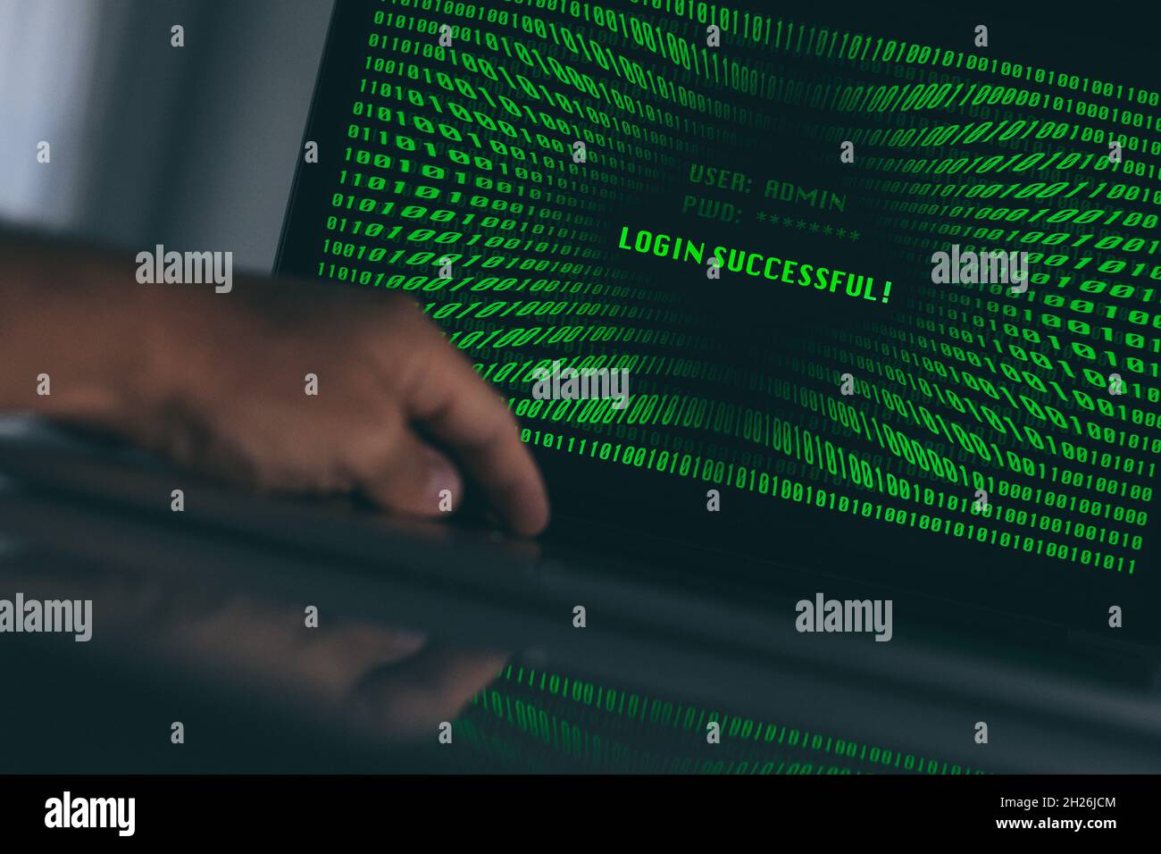 Hand typing on a laptop keyboard green numbers on display. Successful login with credentials ...