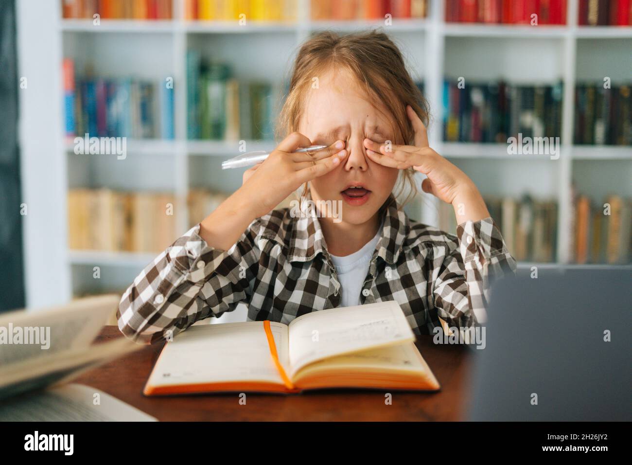 Close-up front view of frustrated exhausted primary child school girl ... Close-up front view of frustrated exhausted primary child school girl ...