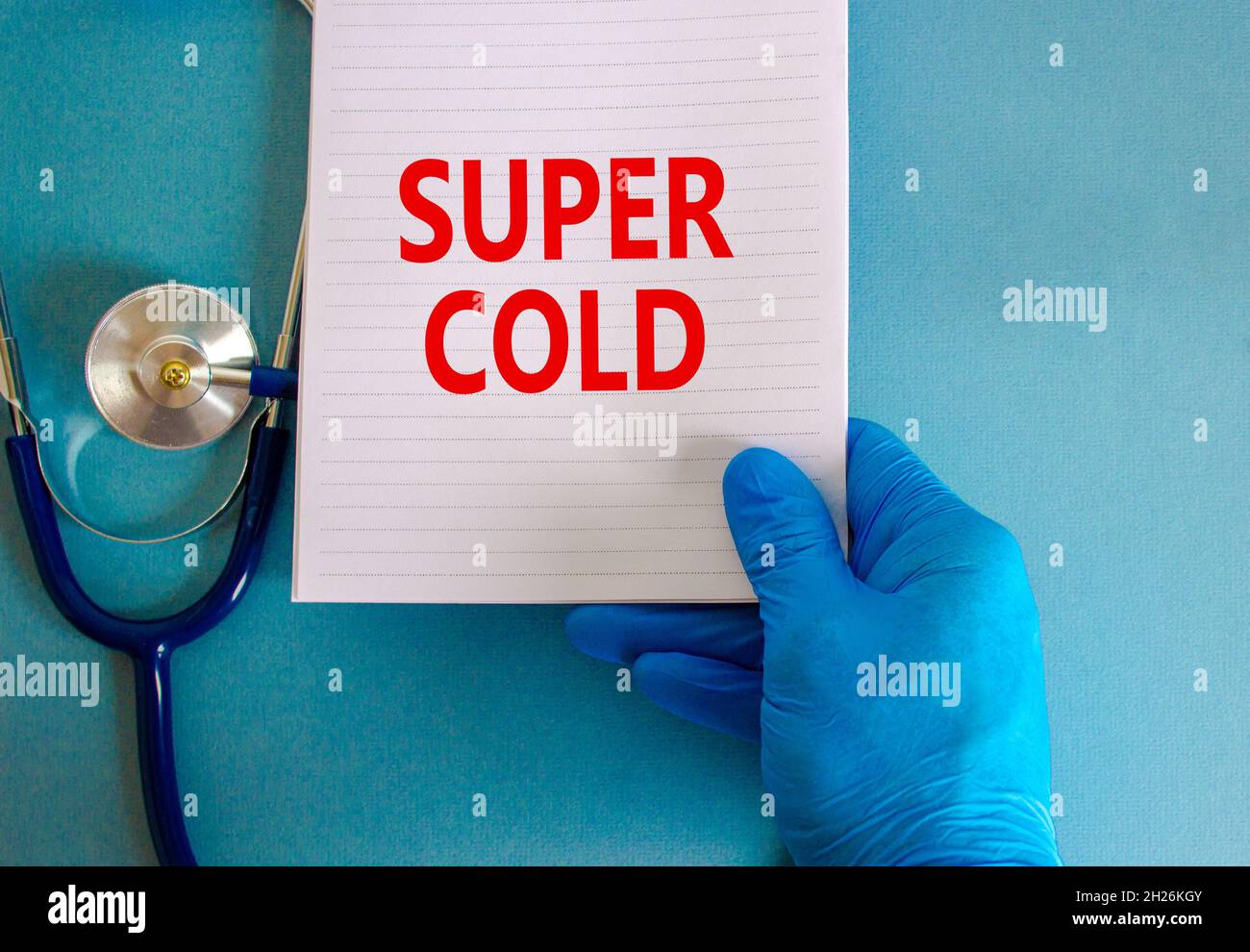 Super cold symbol. Words Super cold on white note. Doctor hand in blue ...
