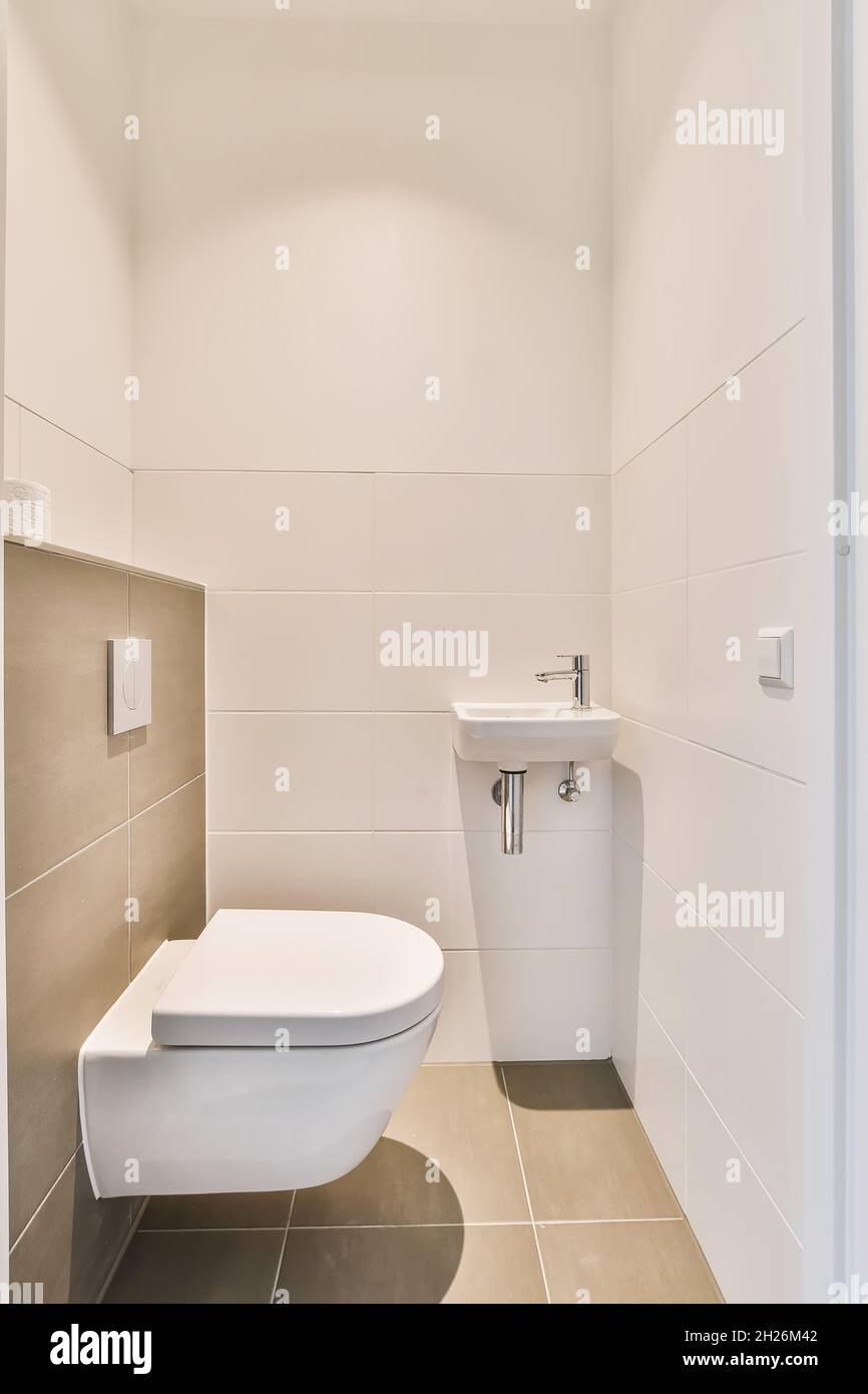 Interior of small clean restroom in miniature style Stock Photo - Alamy