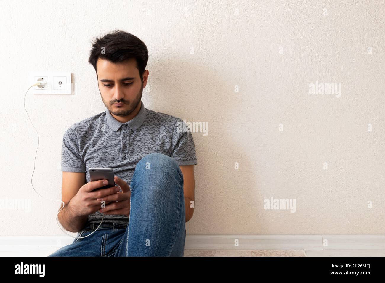 Young Adult Using Smartphone Mobile And Screen Addiction Concept Stock