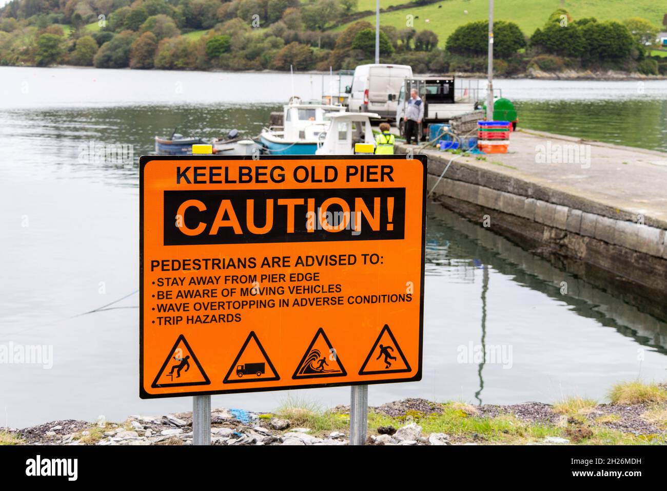 Caution sign on Keelbeg Pier, Union Hall, West Cork Ireland Stock Photo ...