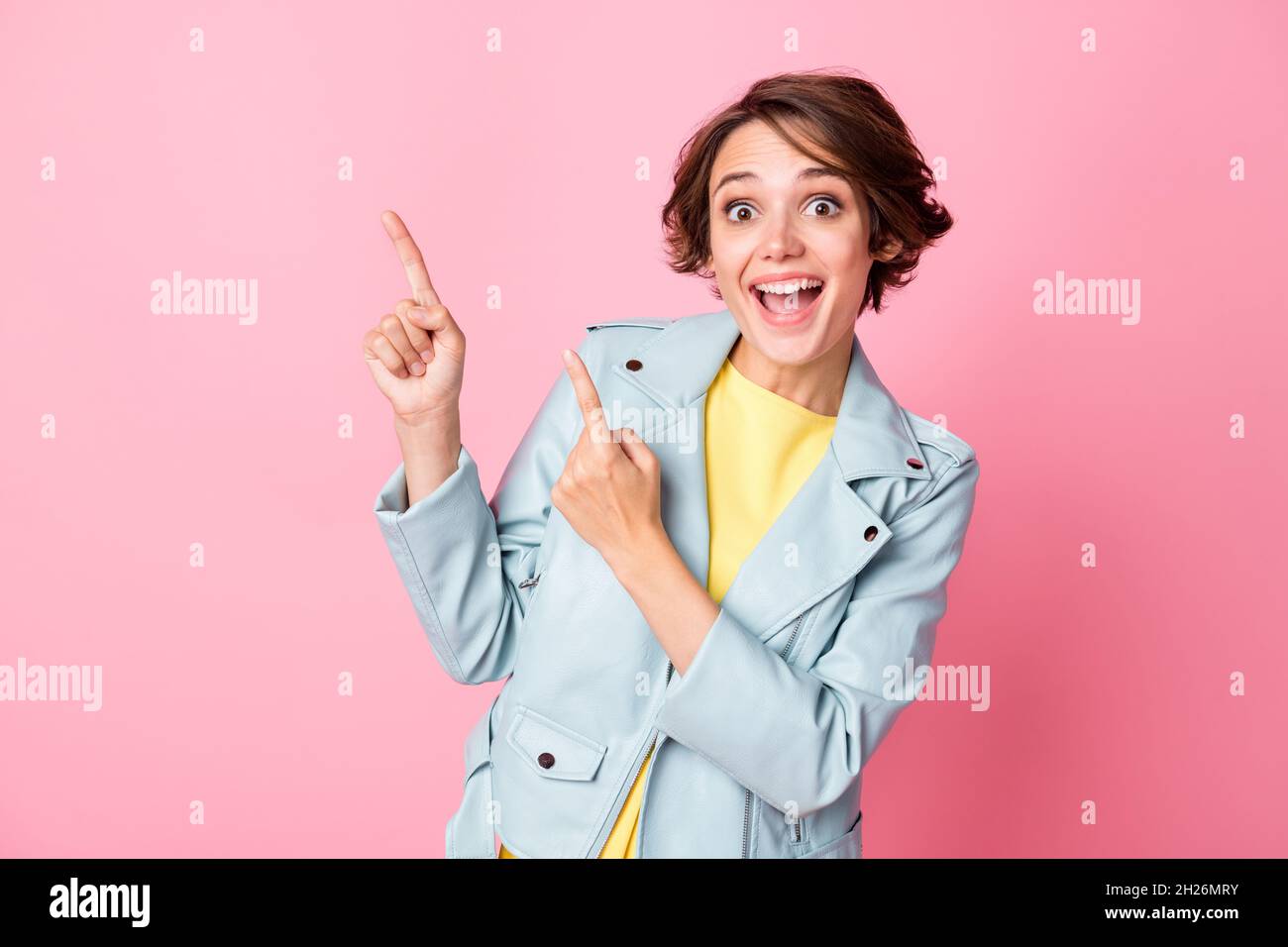 Photo of young girl happy positive smile indicate fingers empty space ...